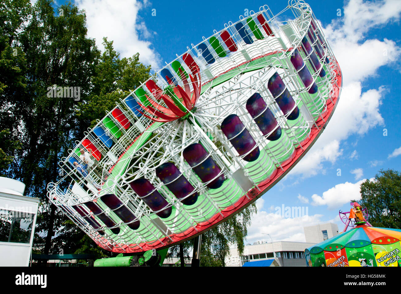 Carousel in an amusement park on sky background Stock Photo - Alamy