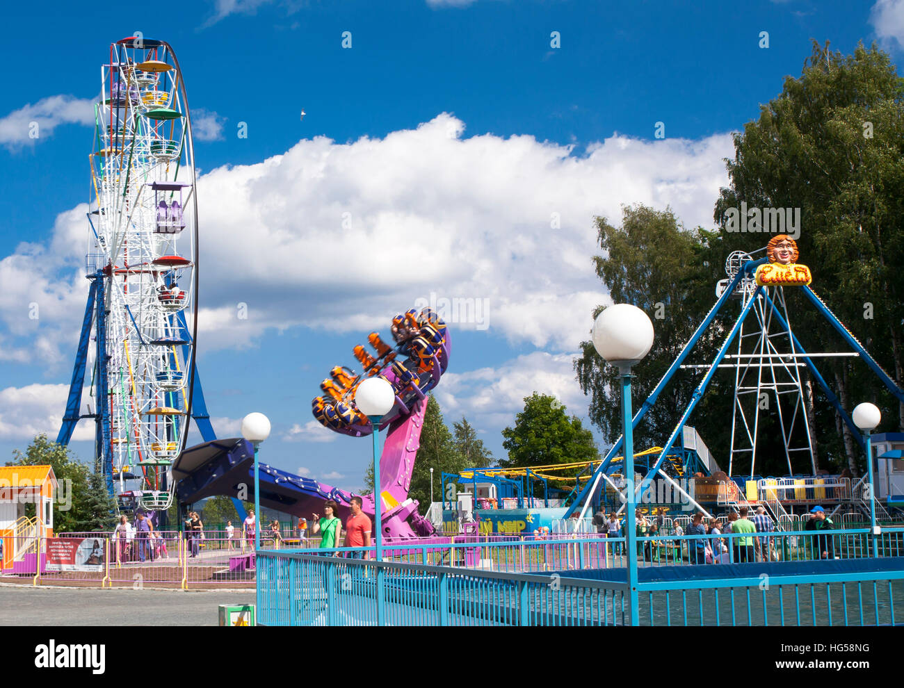 Rides in amusement park, carousel ferris wheel rides Stock Photo - Alamy