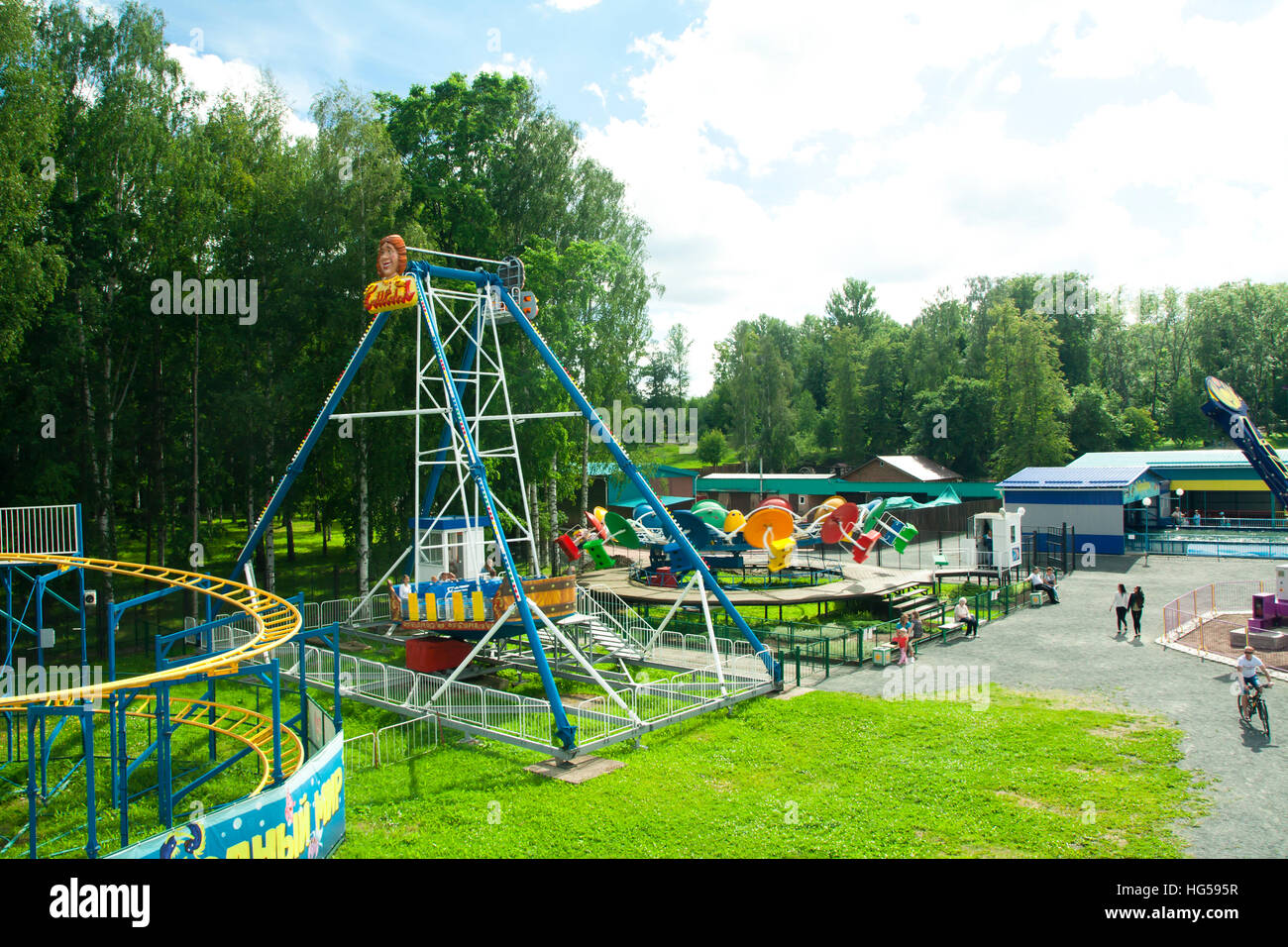 Rides in amusement park, carousel ferris wheel rides Stock Photo - Alamy