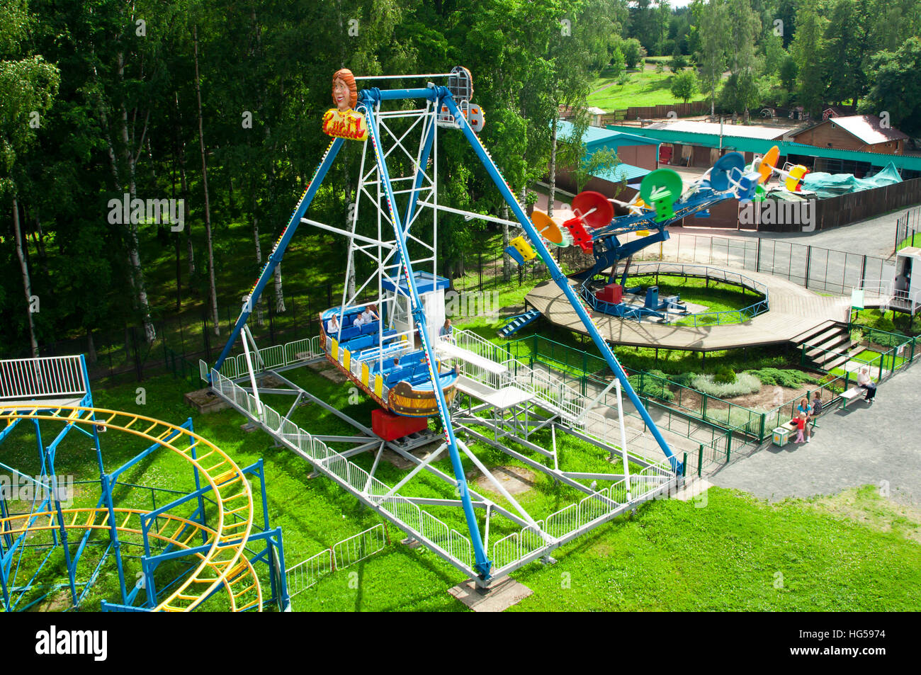 Rides in amusement park, carousel ferris wheel rides Stock Photo - Alamy