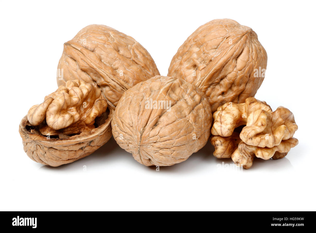 Whole walnut and half walnut piece Stock Photo - Alamy