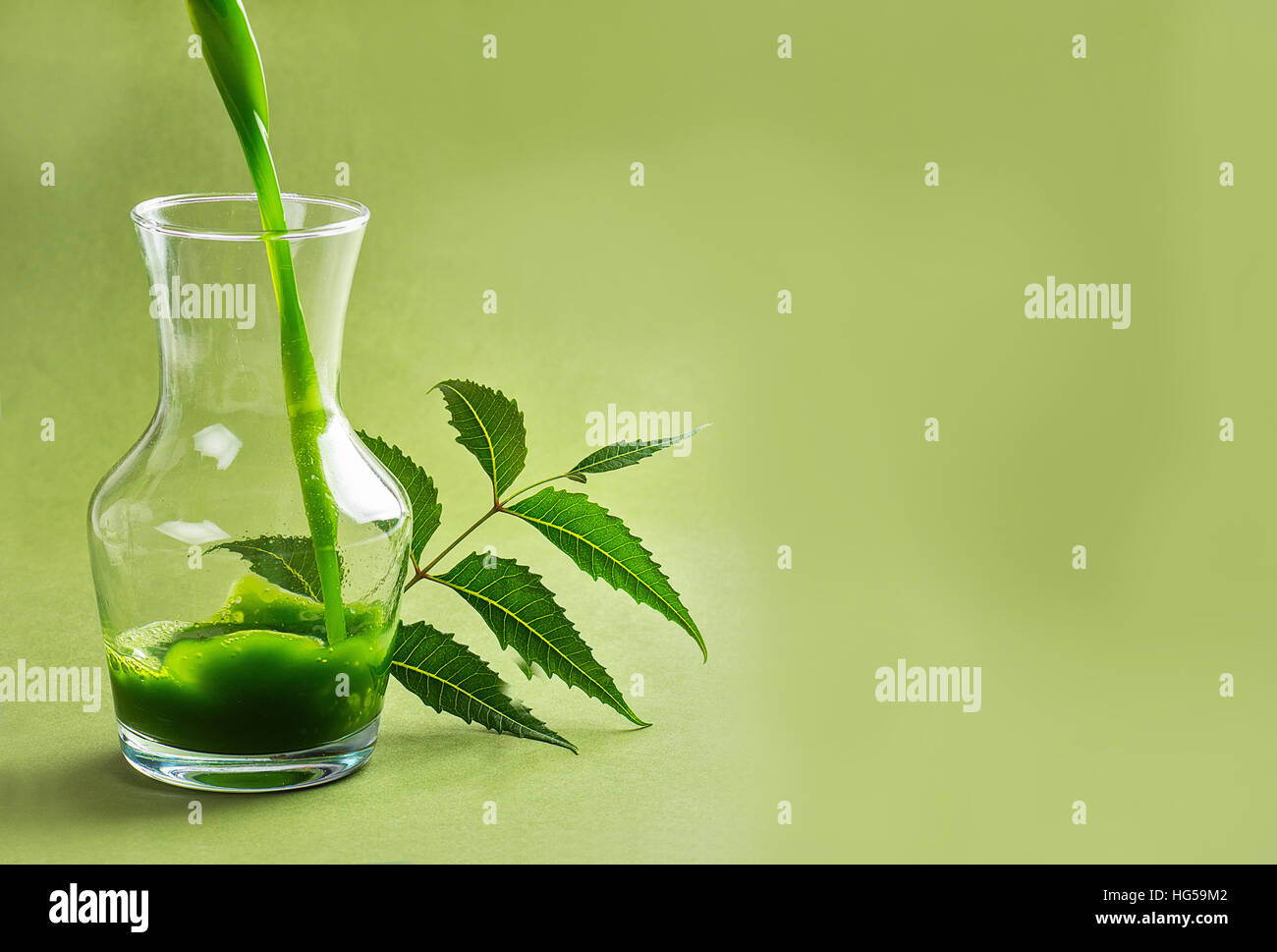 Medicinal Neem juice and leaves Stock Photo - Alamy