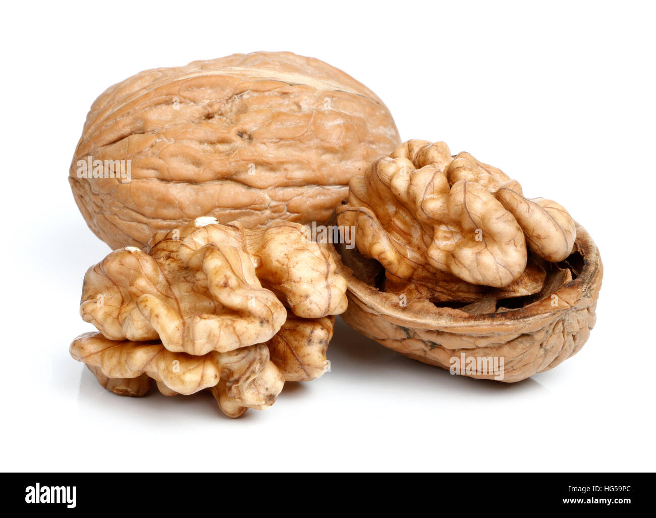 Whole walnut and half walnut piece Stock Photo - Alamy