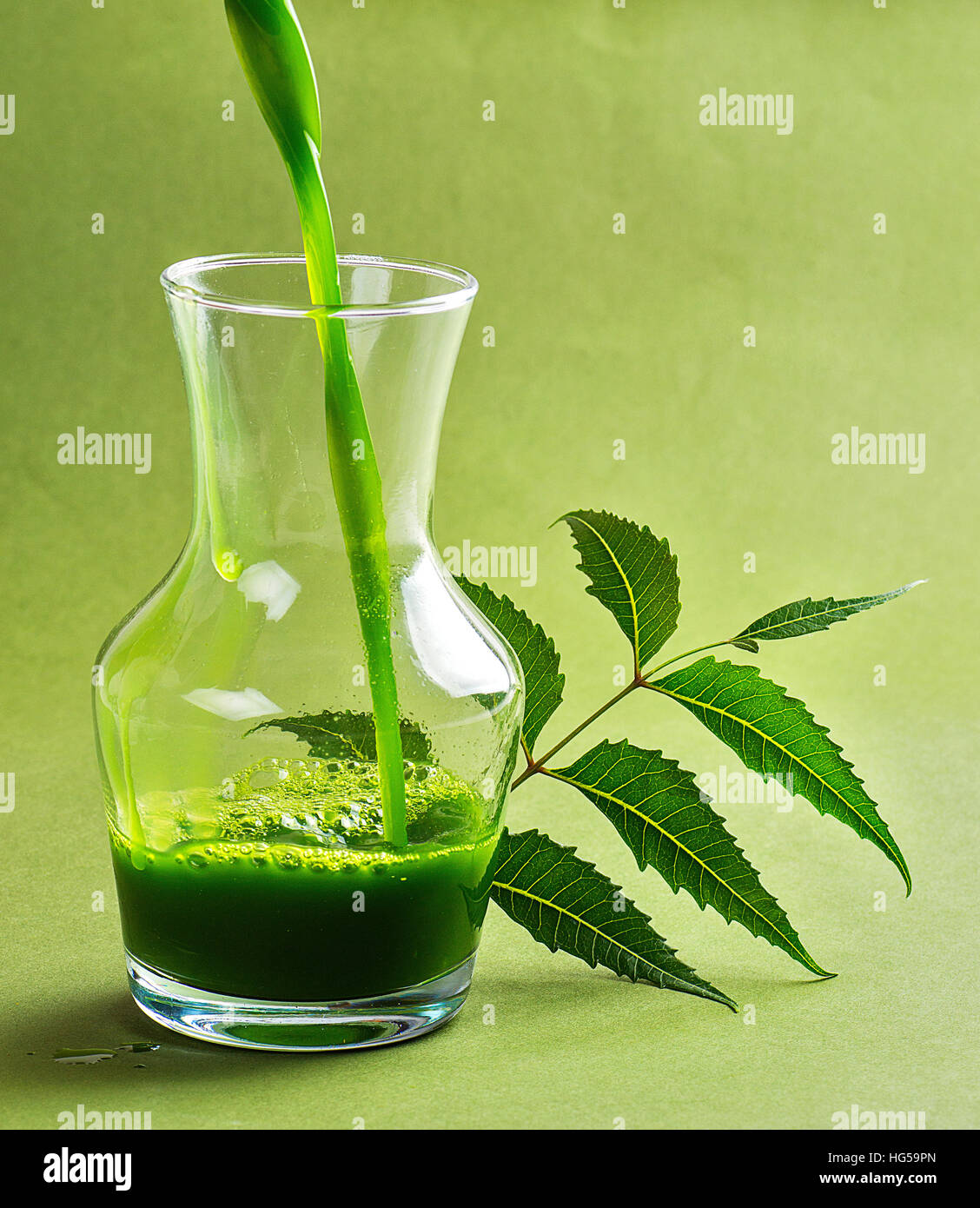 Medicinal Neem juice and leaves Stock Photo - Alamy