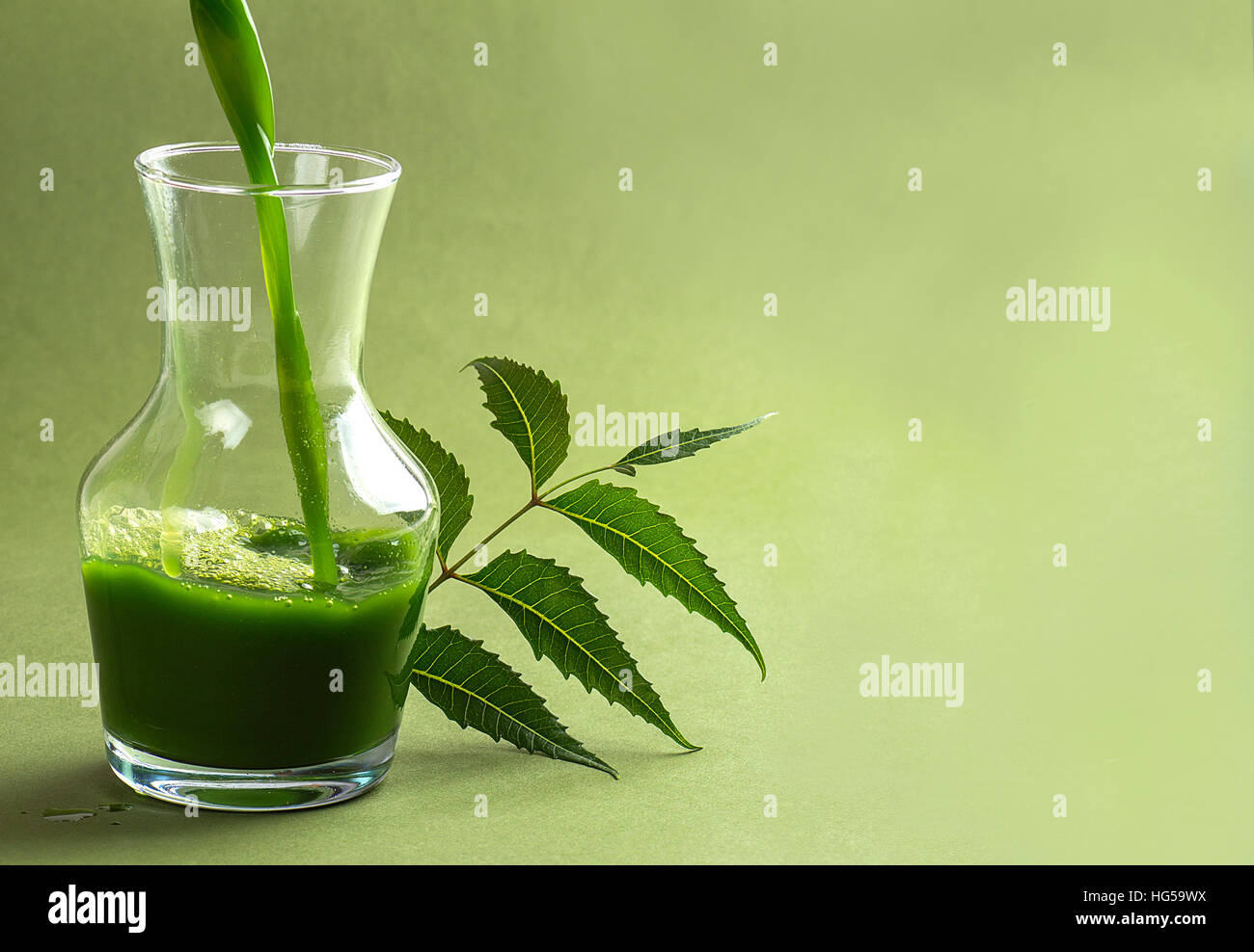 Medicinal Neem juice and leaves Stock Photo - Alamy