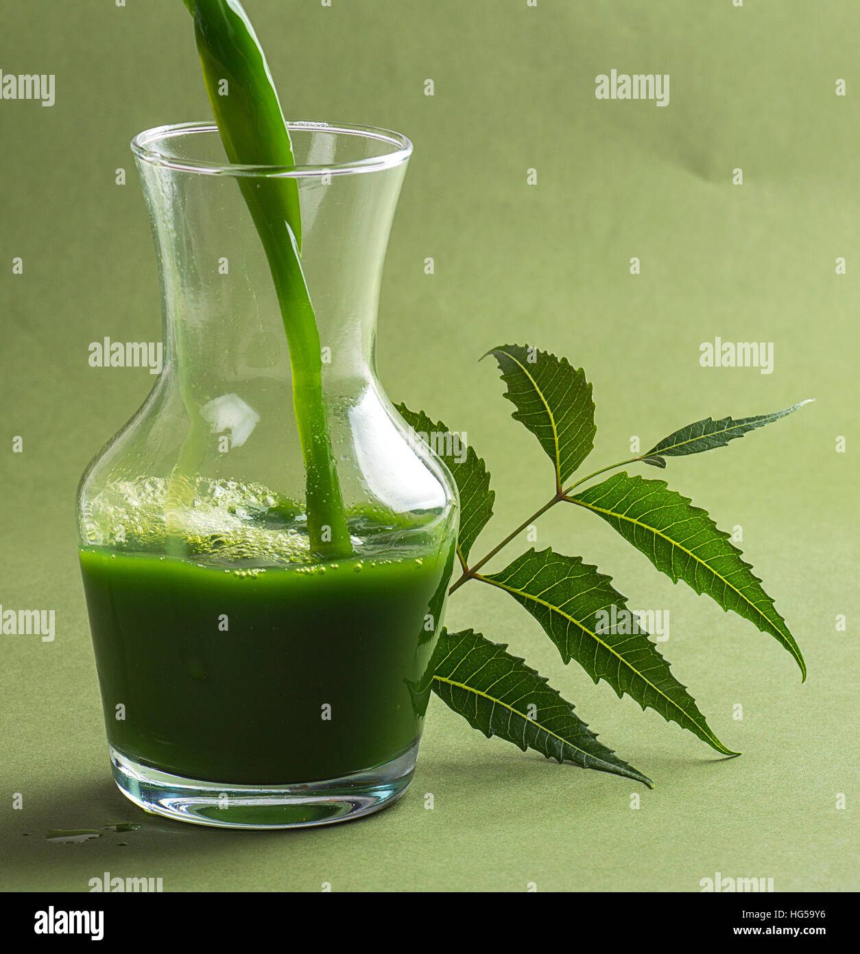 Medicinal Neem juice and leaves Stock Photo - Alamy