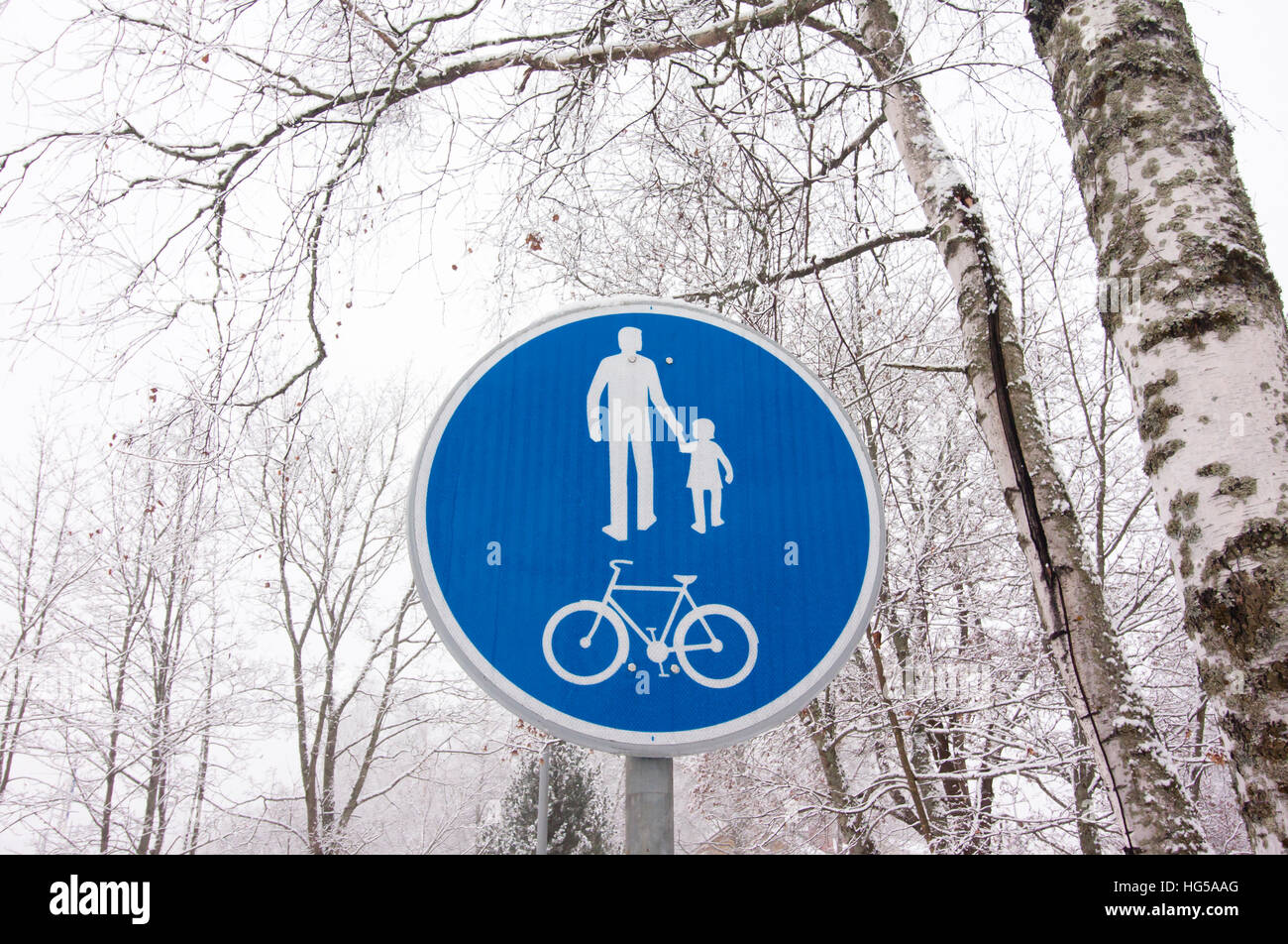 Bicycle and pedestrian lane road sign on pole post Stock Photo - Alamy