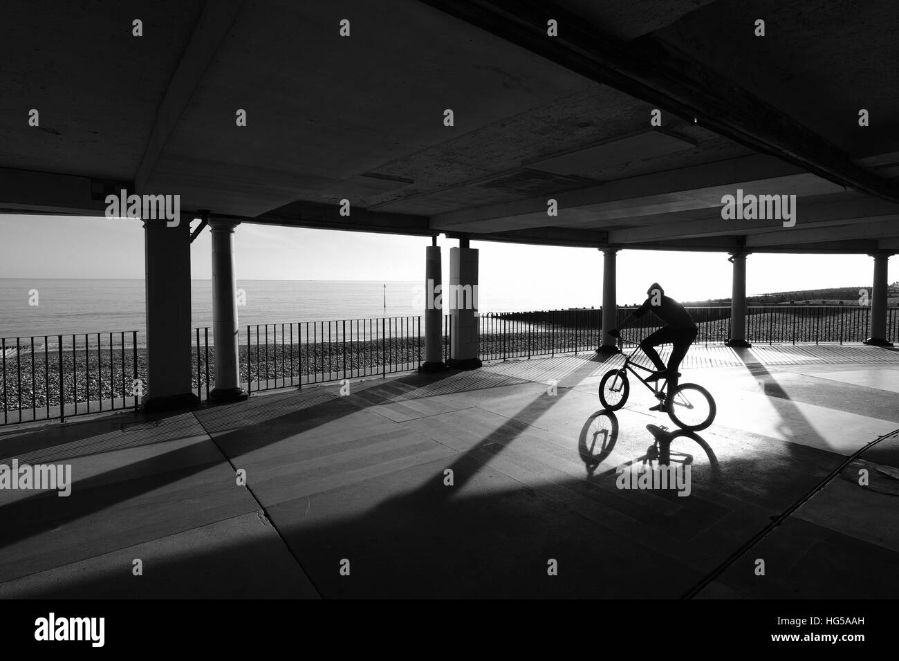Silhouette of boy on a bike Eastbourne Bandstand Stock Photo - Alamy