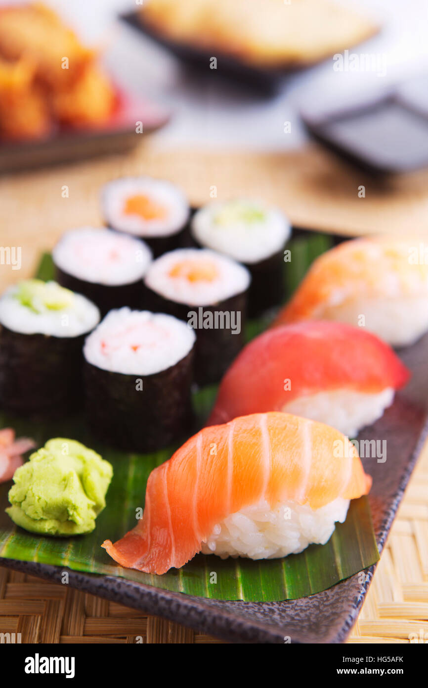 Various Japanese sushi on a plate. Photographed with a shallow depth of ...