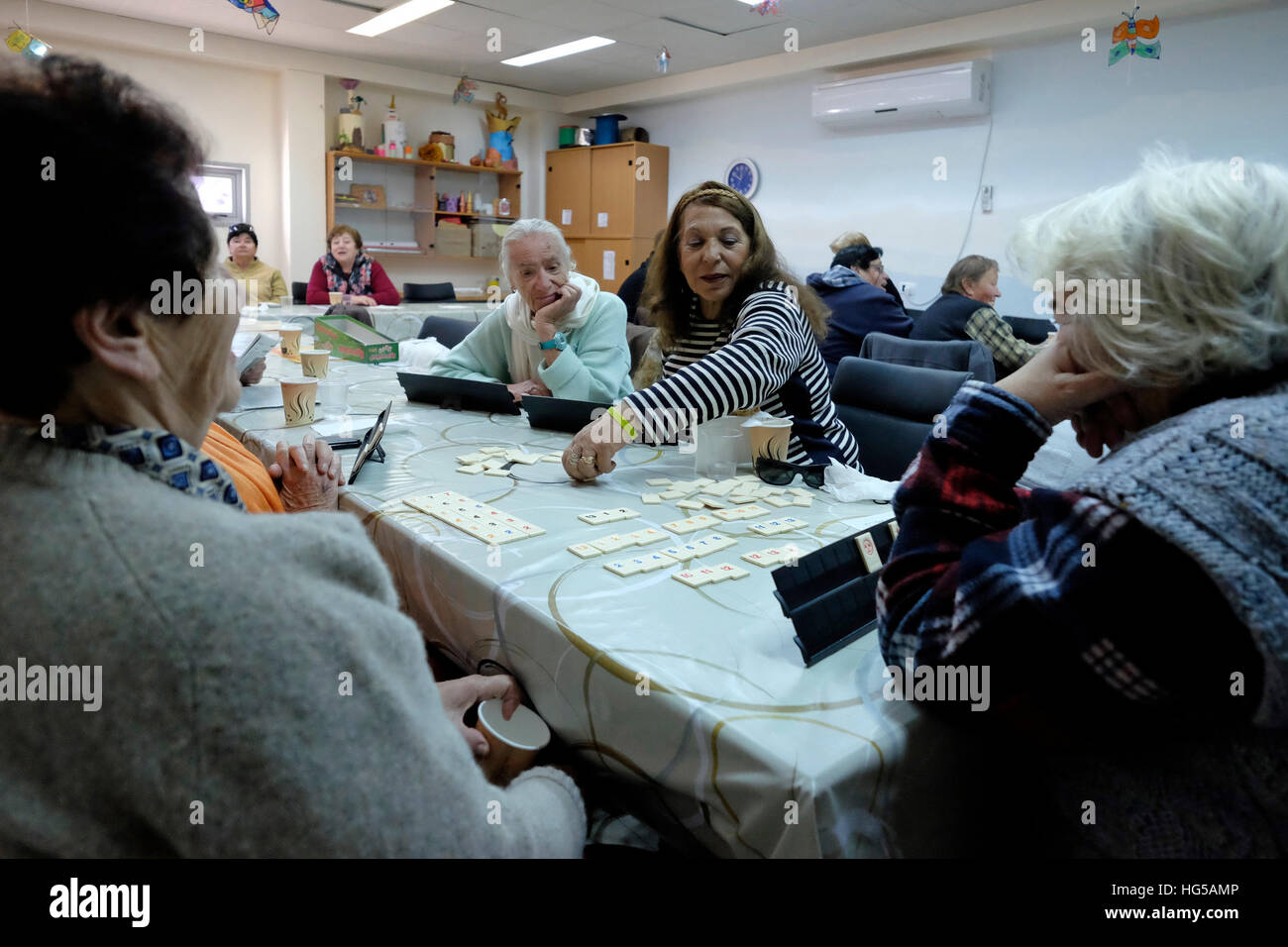 Elderly Israeli women playing domino inside the culture center of ...