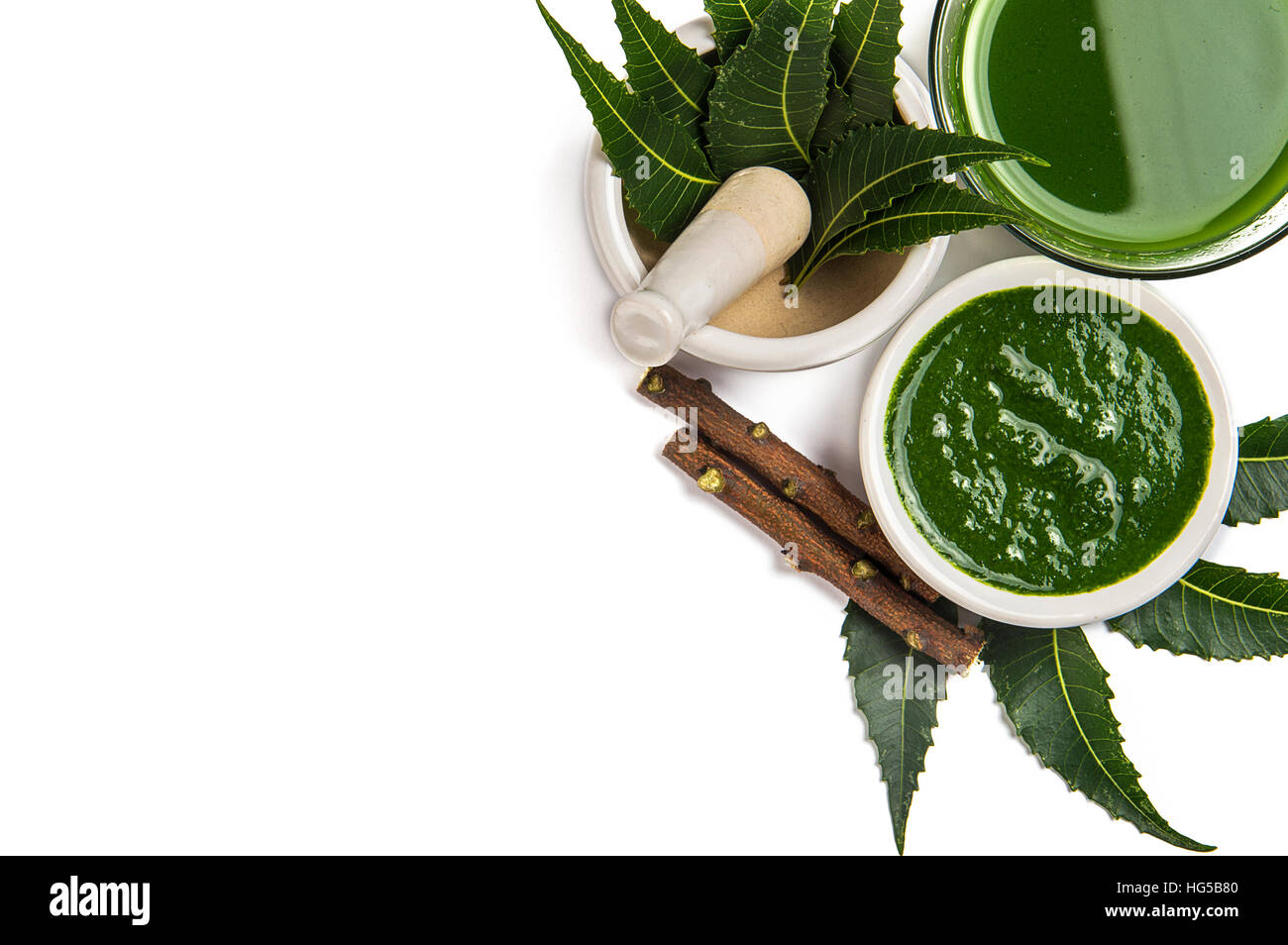 Medicinal Neem leaves in mortar and pestle with neem paste, juice and ...