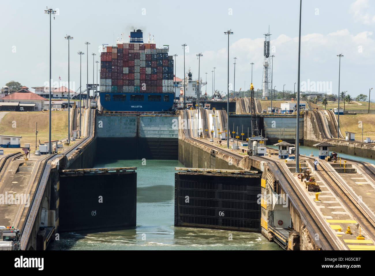 Panamax-sized container ship goiing up through Gatun Locks on Panama ...