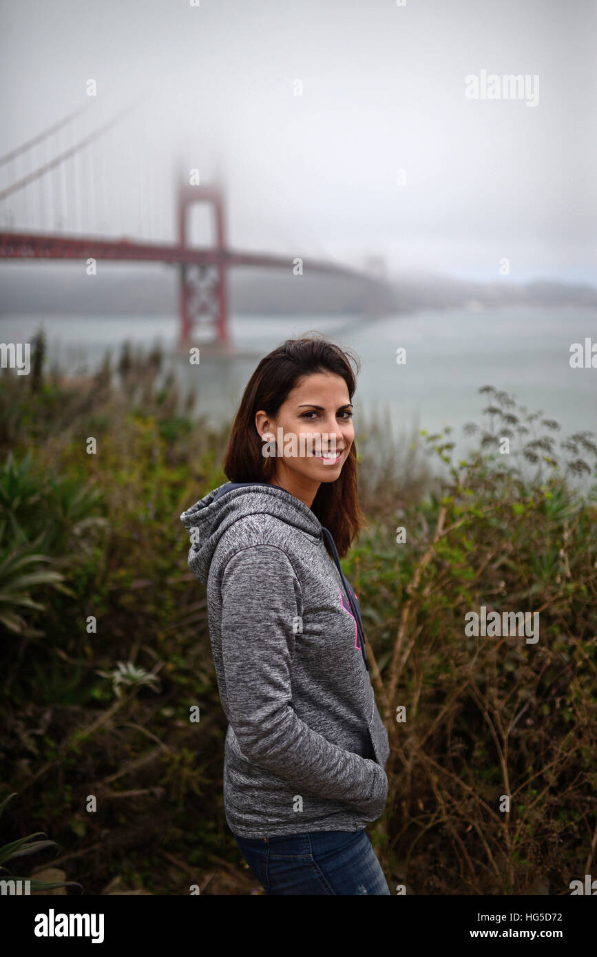 Young woman and Golden Gate Bridge, San Francisco Stock Photo - Alamy