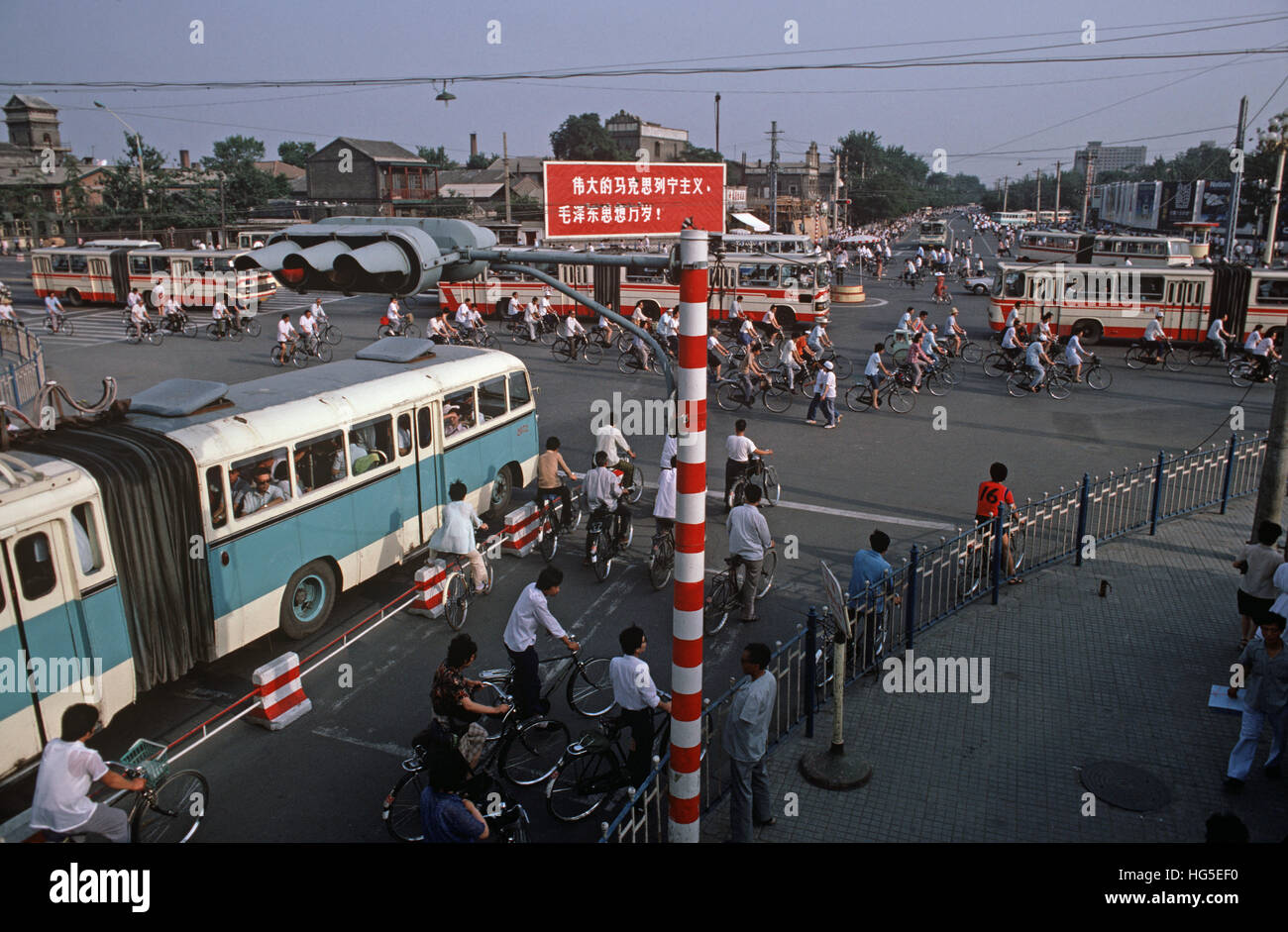 Busy city traffic intersection with pedestrians and cyclists, Beijing ...