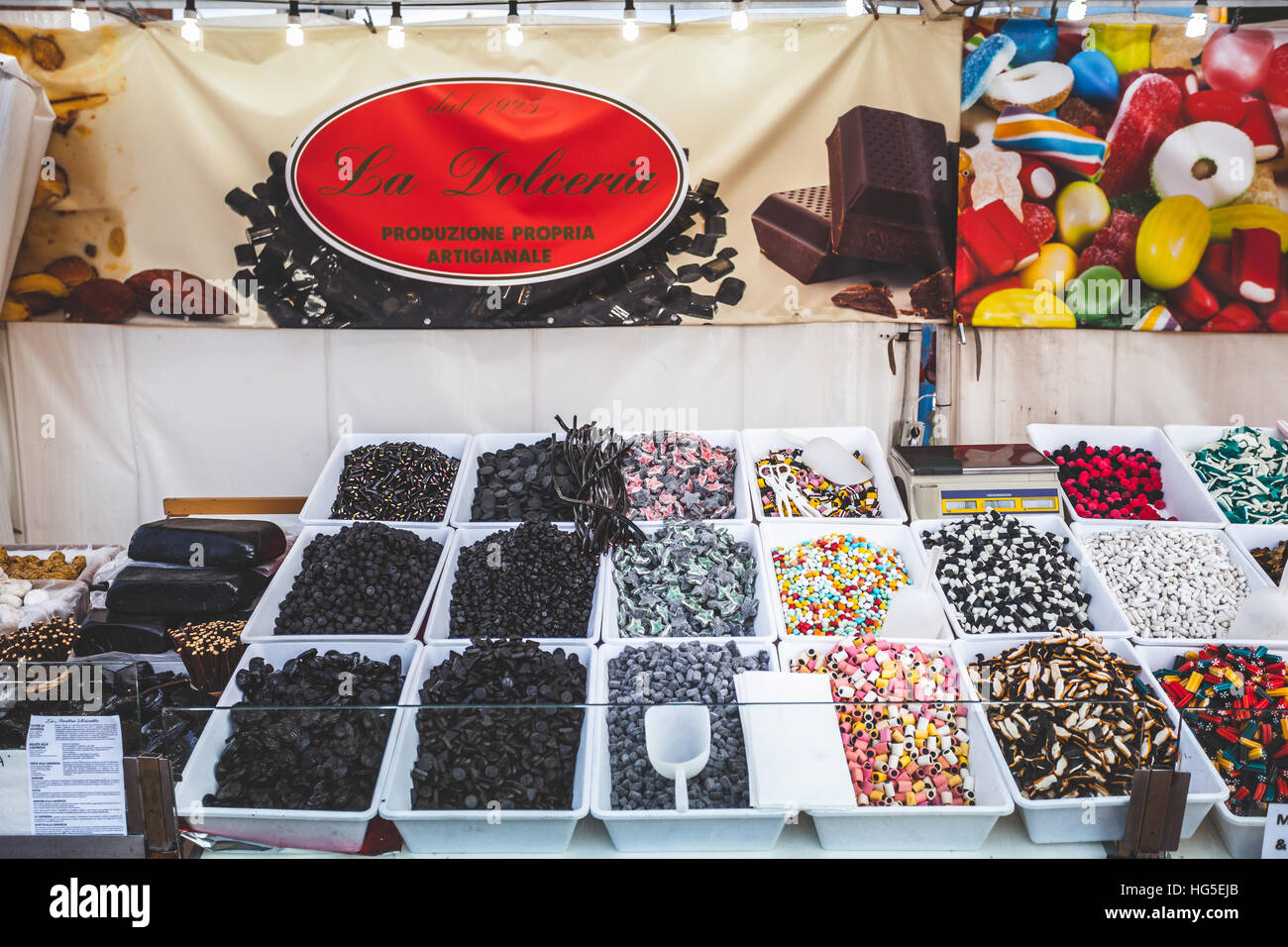 La Dolceria - Italian assortment of sweets candy in white recipients Stock Photo - Alamy