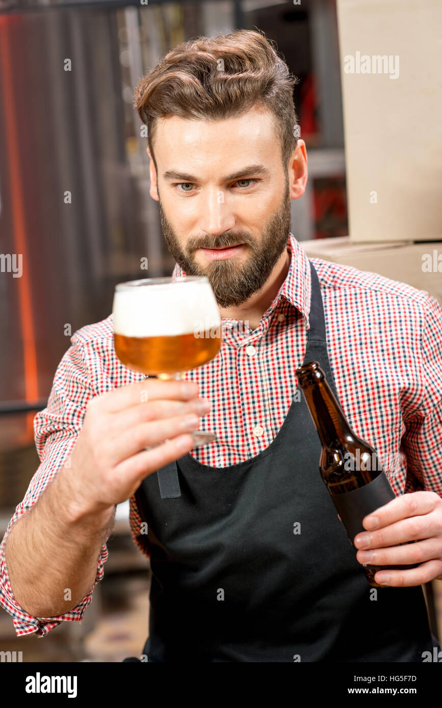Brewer expertising beer Stock Photo - Alamy