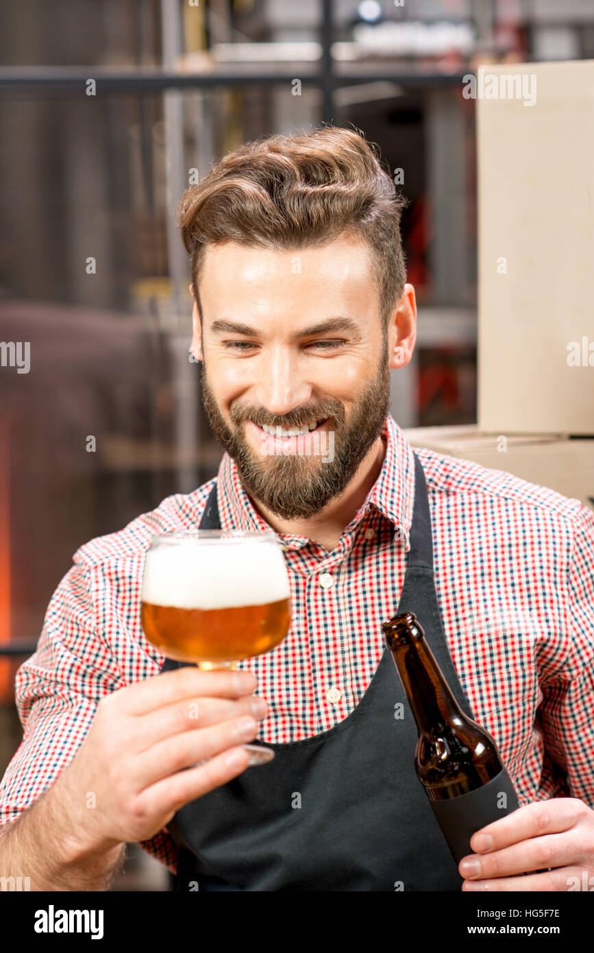 Brewer expertising beer Stock Photo - Alamy