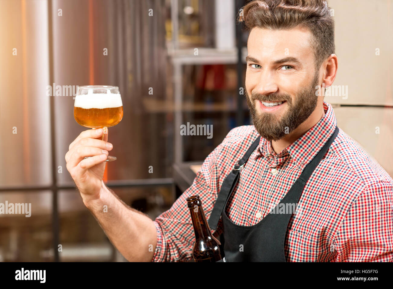 Brewer expertising beer Stock Photo - Alamy
