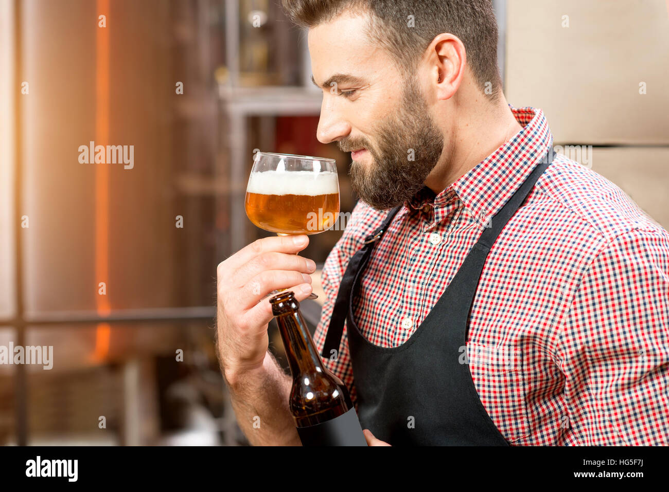 Brewer expertising beer Stock Photo - Alamy