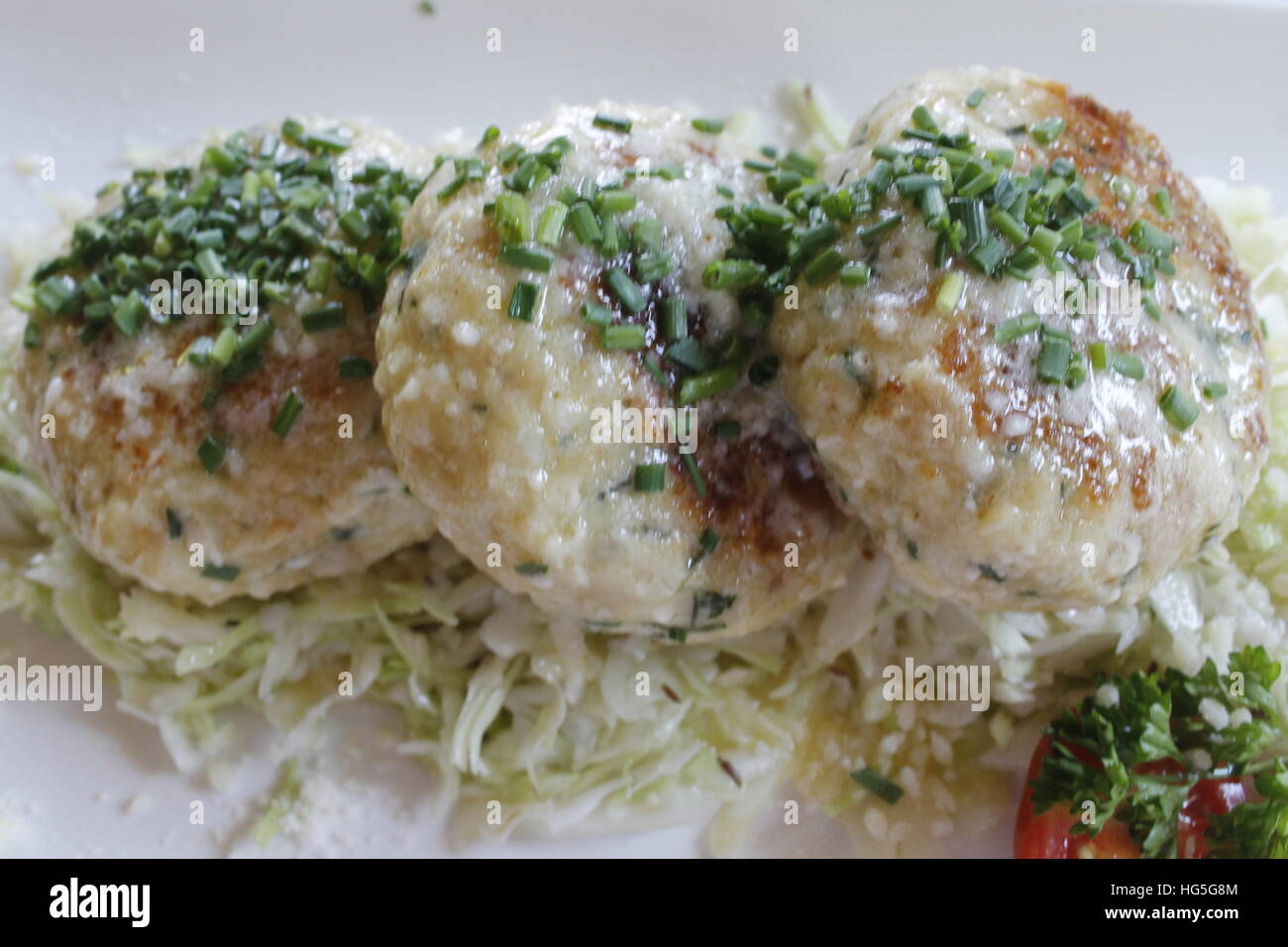 Tyrolean traditional dish, knodel or canederli with parsley Stock Photo ...