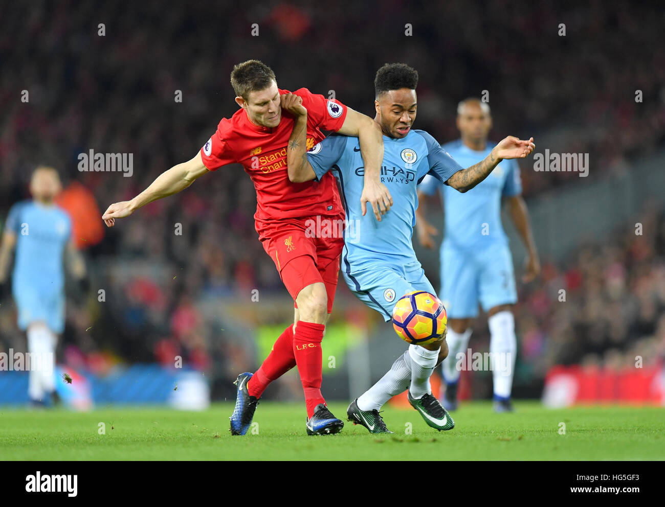Liverpool's James Milner (left) and Manchester City's Raheem Sterling ...