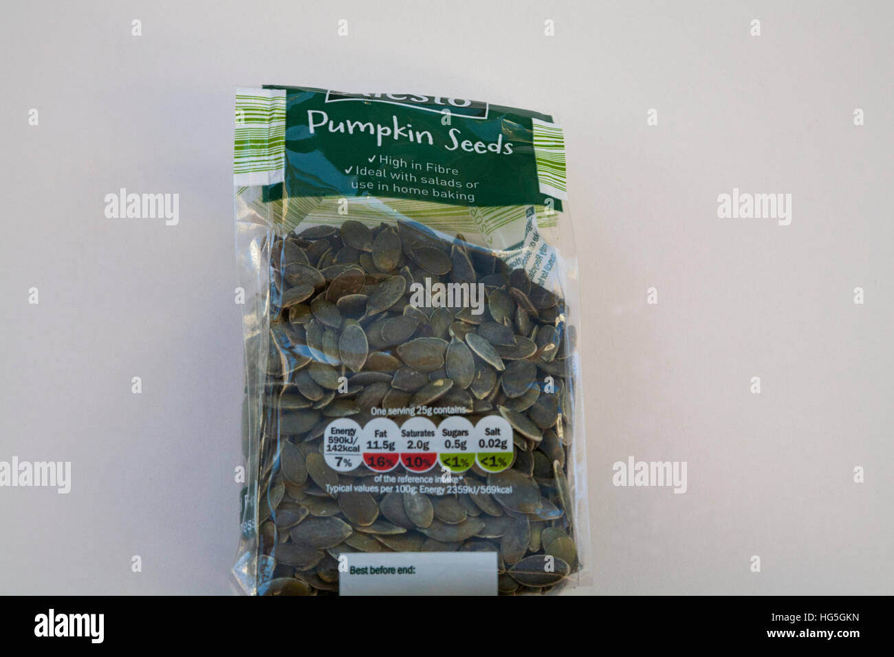 Close up packet fresh Pumpkin seeds on white background Stock Photo - Alamy