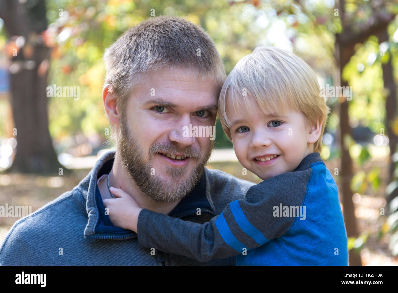 white father and son on a beautiful day at the park Stock Photo - Alamy