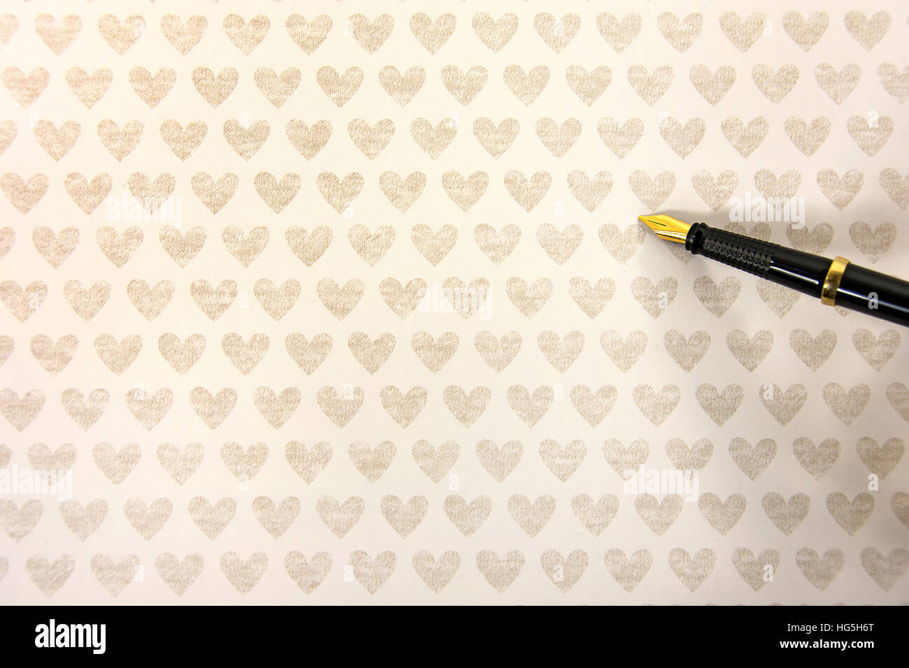 old-fashioned fountain pen on gold heart paper Stock Photo - Alamy