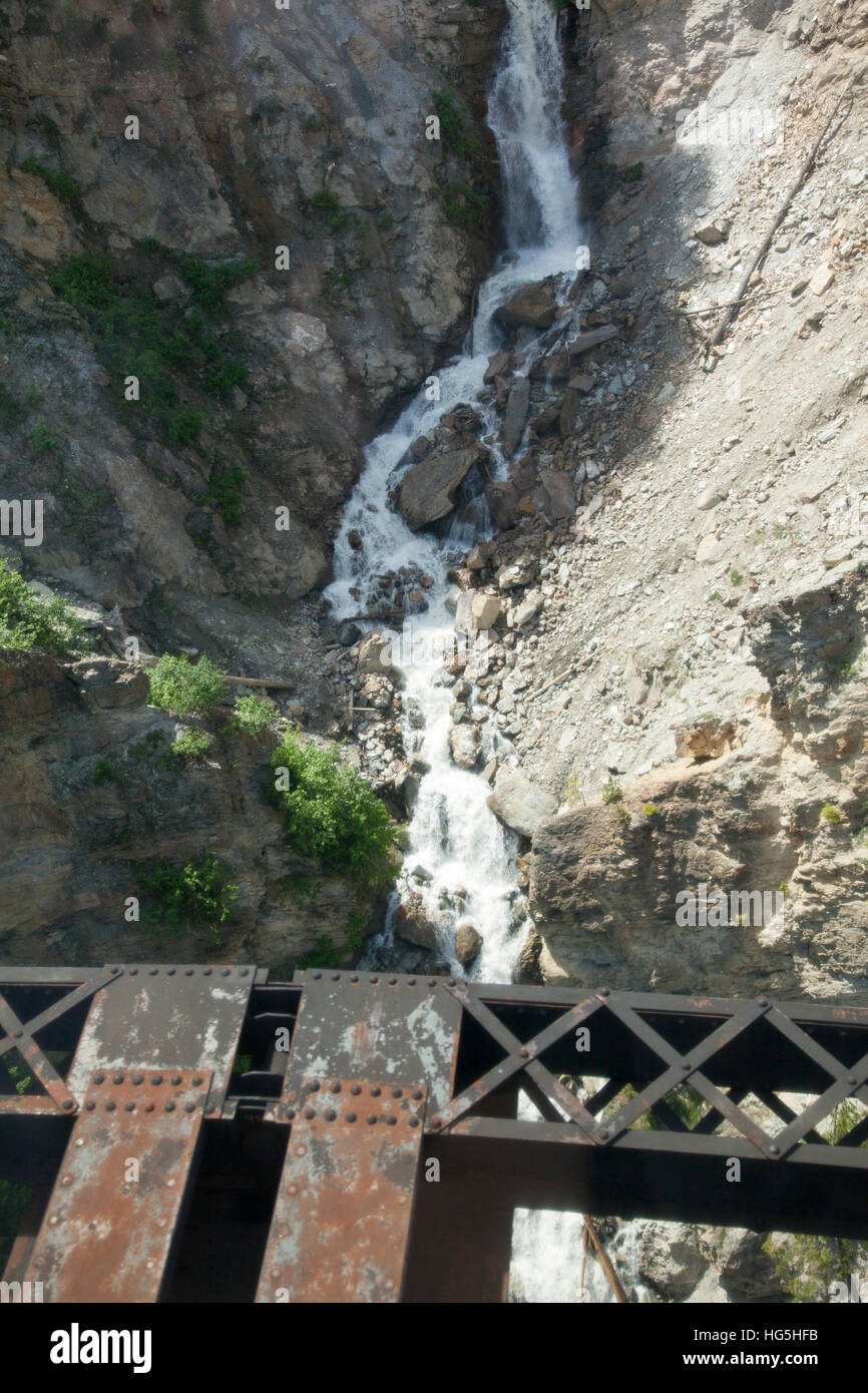 A very narrow rail bridge in the Canadian Rocky Mountains showing the ...