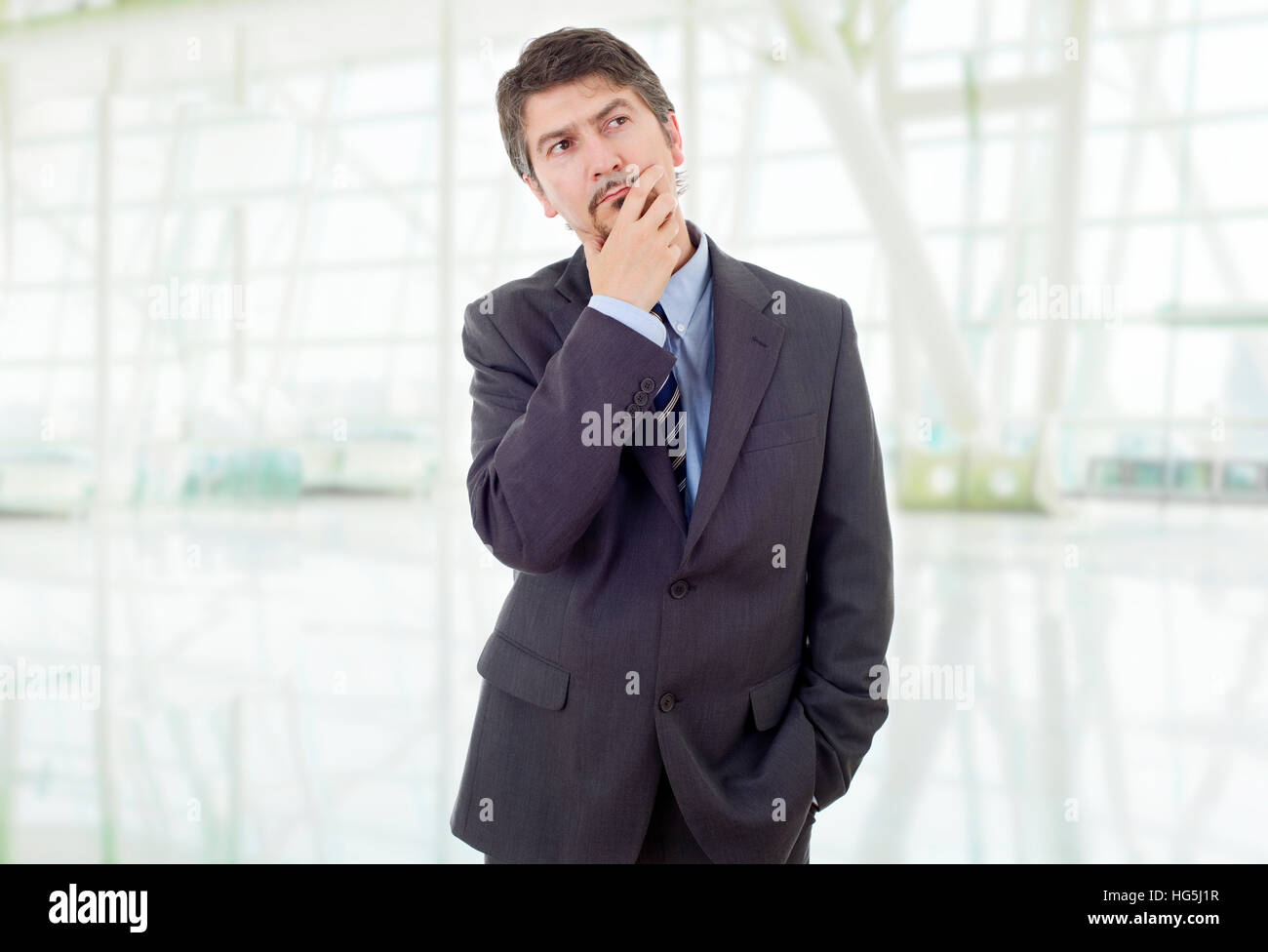 young business man thinking, at the office Stock Photo - Alamy