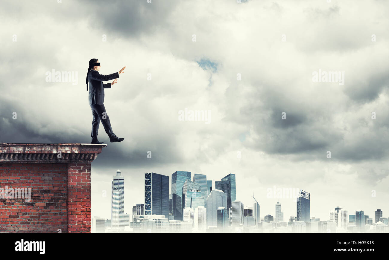 Danger and risk concept with businessman making step from edge Stock ...