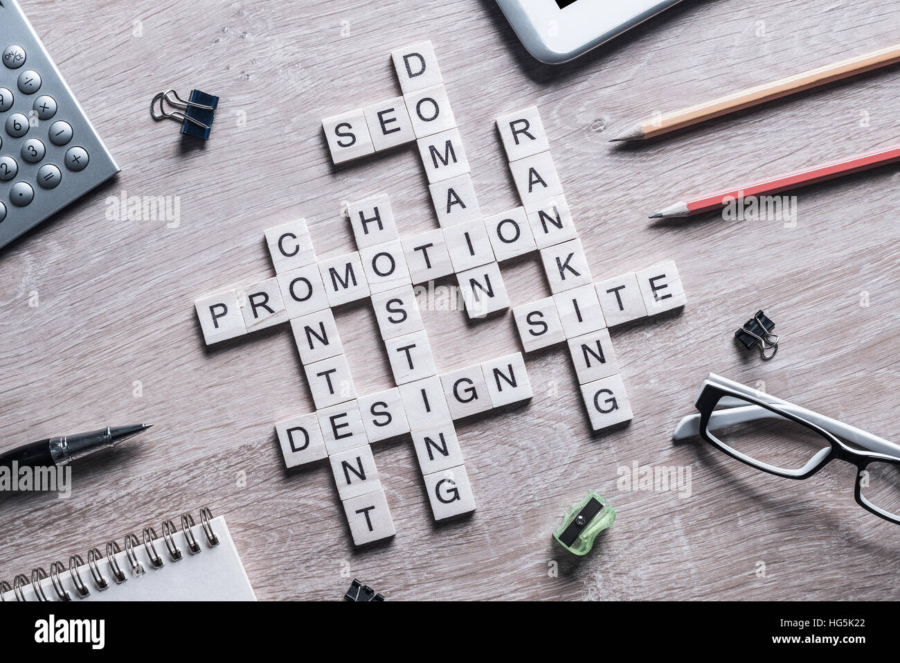 Words of business concepts collected in crossword with wooden cubes ...