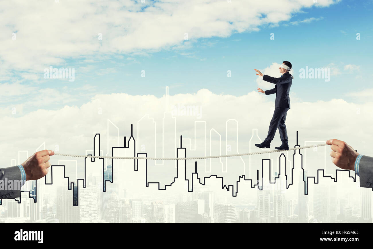 Business concept of risk support and assistance with man balancing on ...