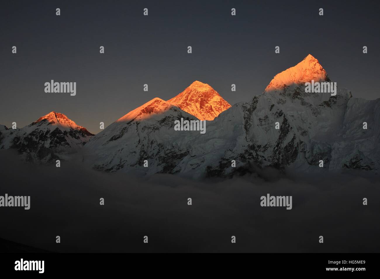 High mountains Khumbutse, Everest and Nuptse at sunset Stock Photo - Alamy