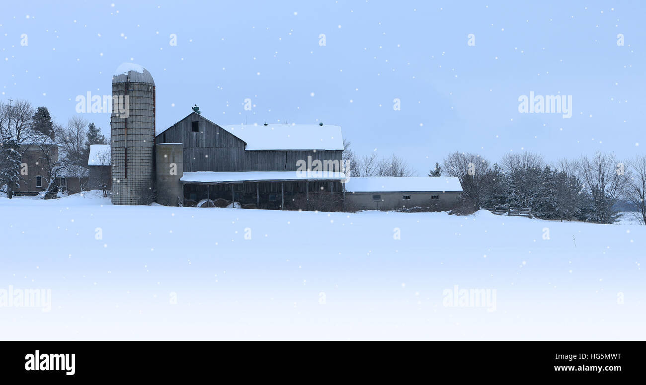 An Old barn with falling snow Stock Photo - Alamy