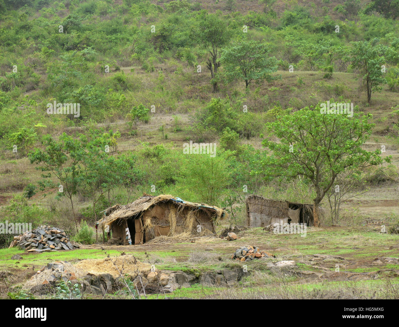 Landscape - Rural village scene with grass hut Stock Photo - Alamy