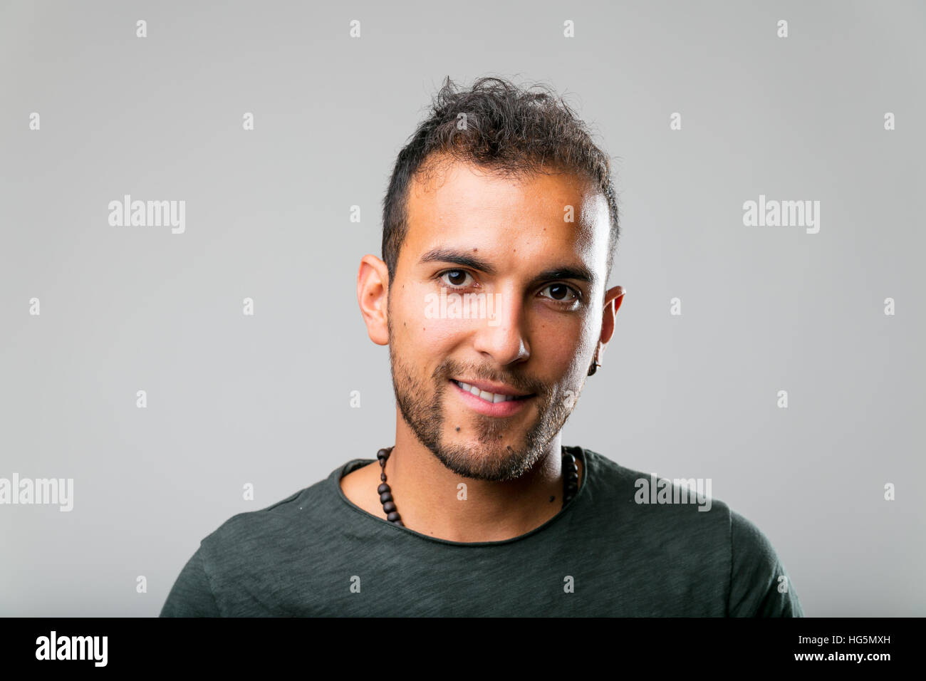 studio shot (portrait) of a latin-american handsome young man that ...