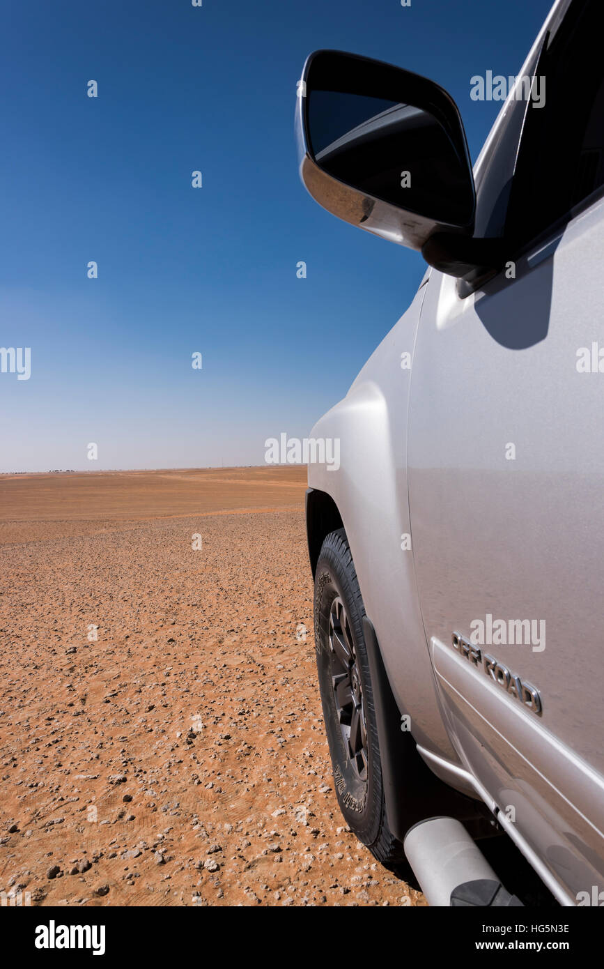 Close-up vertical view of a 4x4 off-road vehicle's left front side in ...