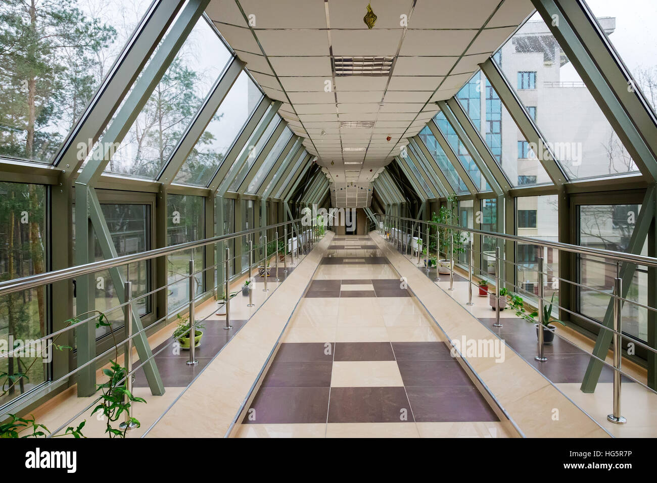 Comfortable glazed passage connecting the two neighboring buildings ...
