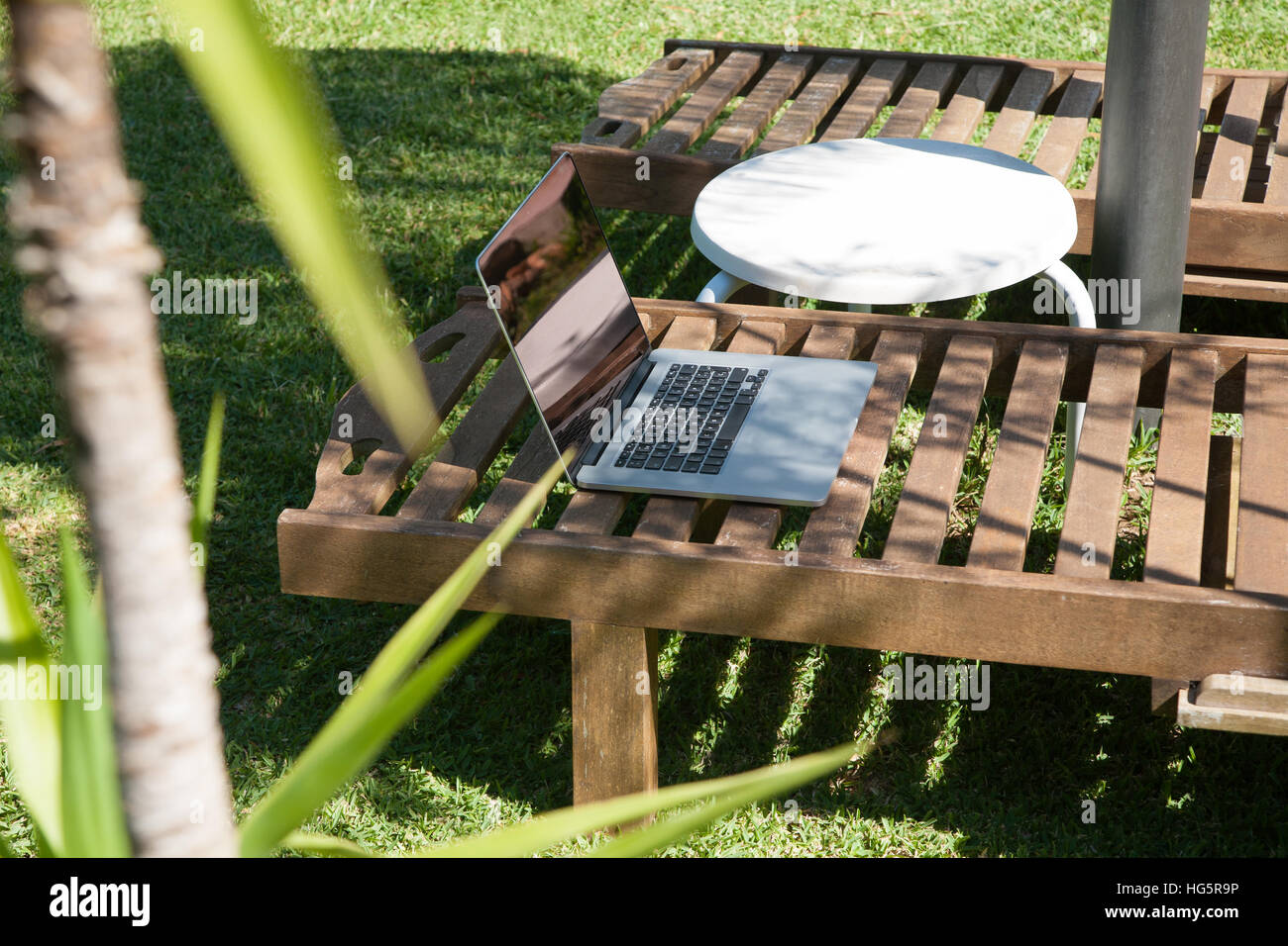 grey laptop computer open with blank screen and keyboard on wooden ...