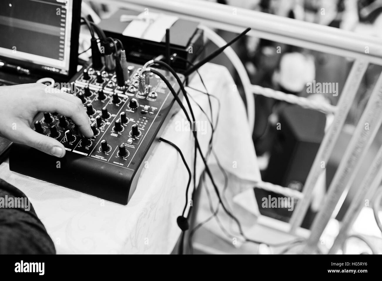 Hand of man on digital mixing console. Sound mixer control panel ...