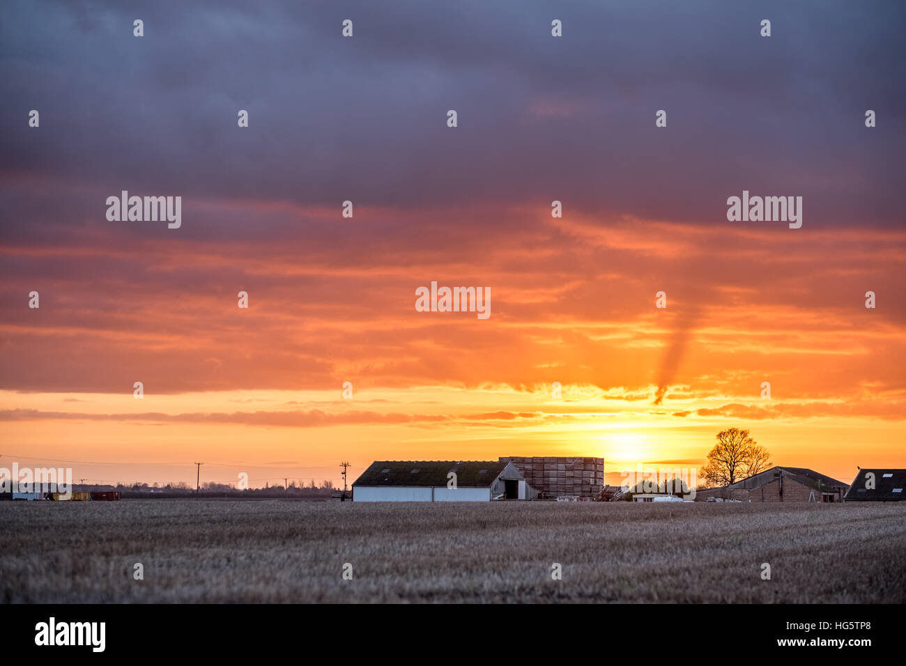 A storm brews over a farm Stock Photo - Alamy