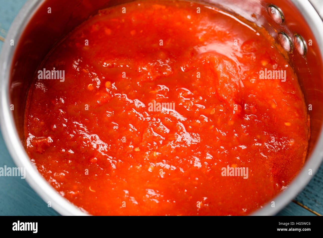 Preparing Tomato Sauce In Metal Pot Stock Photo - Alamy