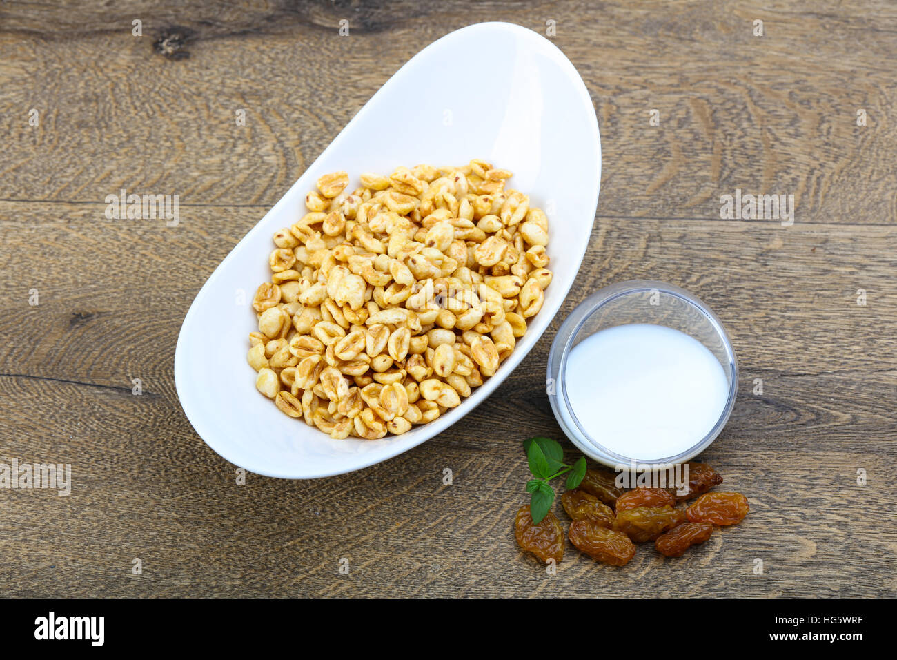 Rise flakes with milk, raisin and mint leaves Stock Photo - Alamy