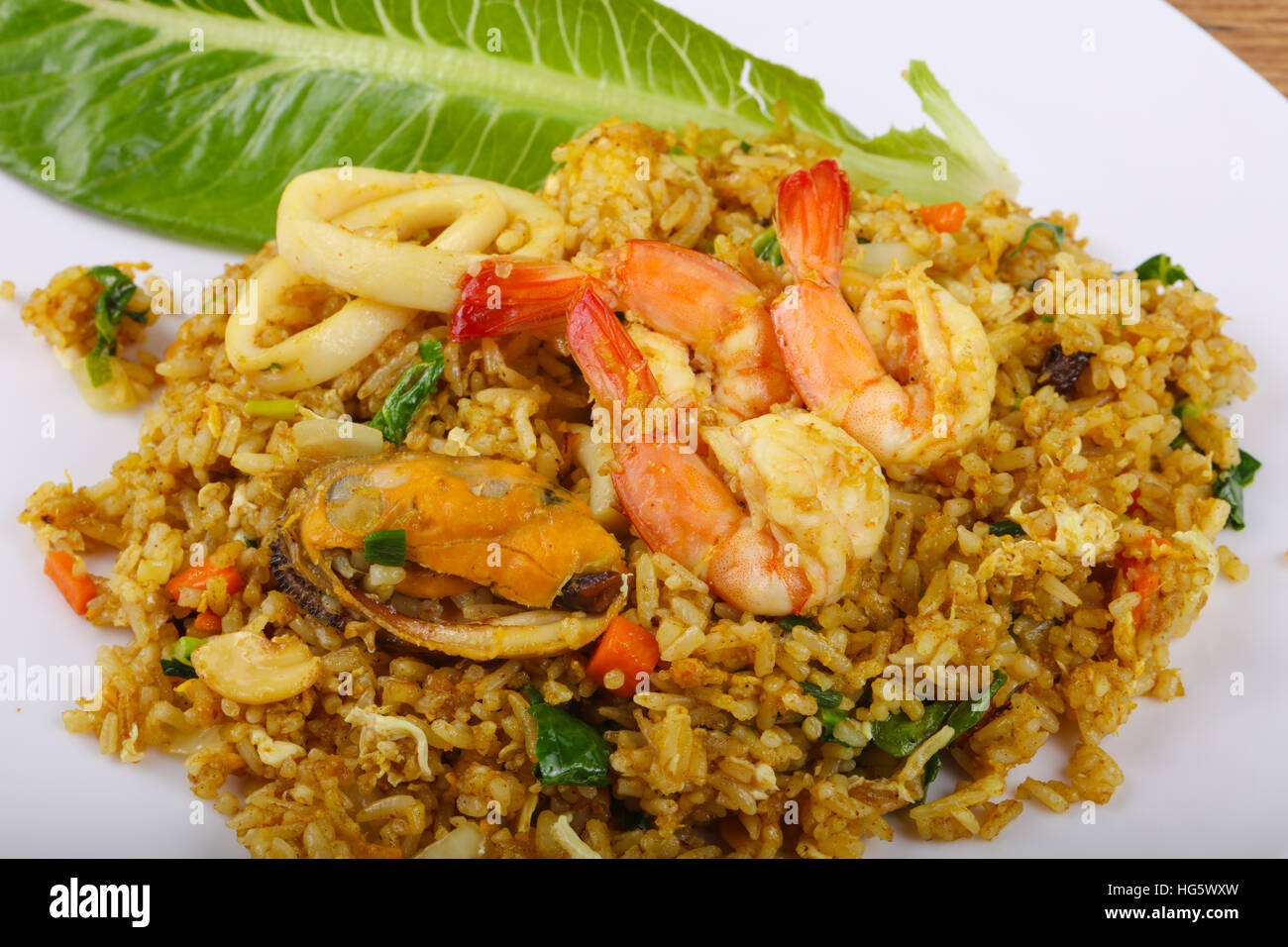 Fried rice with seafood - shrimp, mussel, squid Stock Photo - Alamy