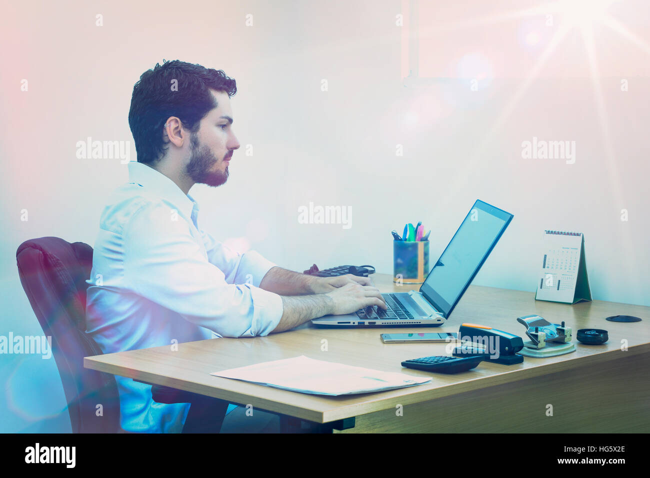 Man typing at desk profile hi-res stock photography and images - Alamy