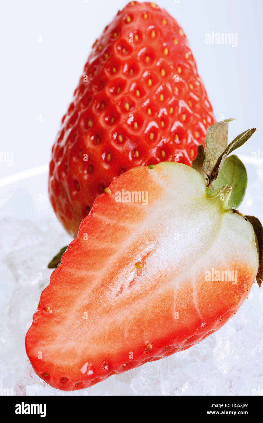 Halved strawberry on crushed ice Stock Photo - Alamy