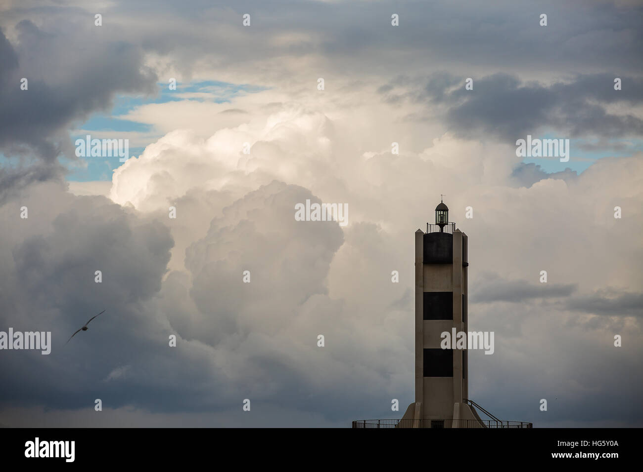 Tower lighthouse on the background of a winter storm sky Stock Photo ...