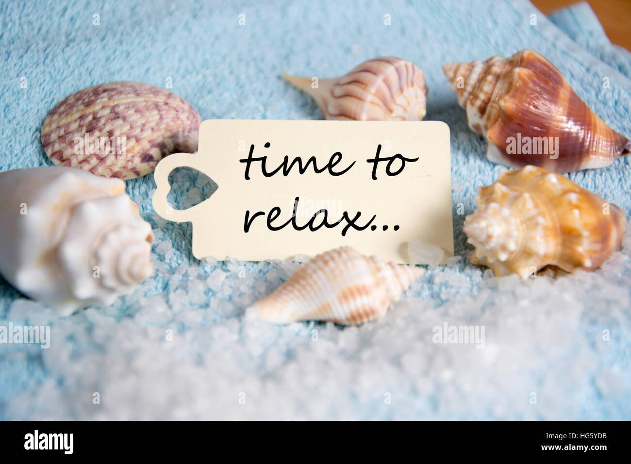 Shell with candle light and empty tag for wellness and relaxing ...