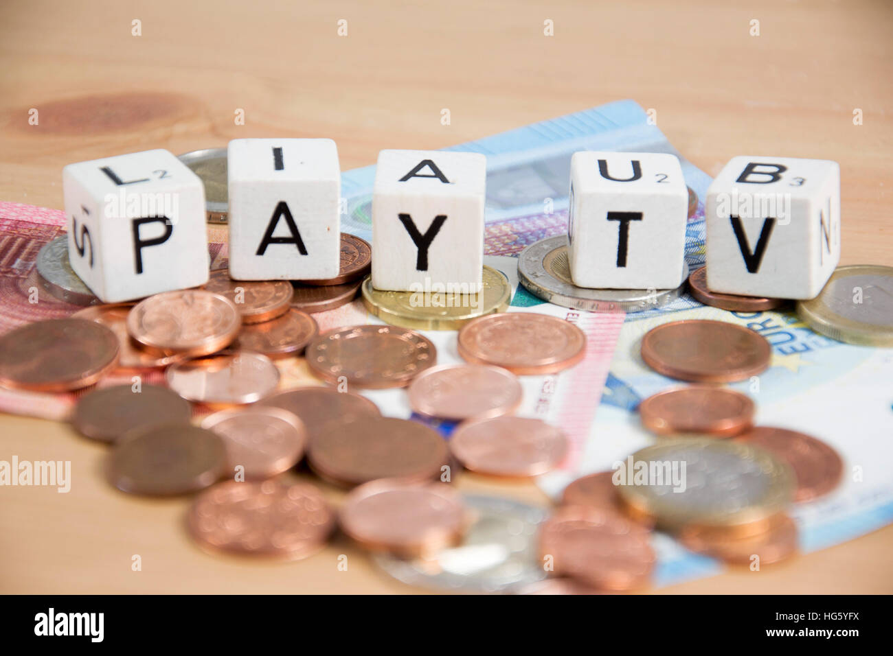 white remote with money Stock Photo - Alamy